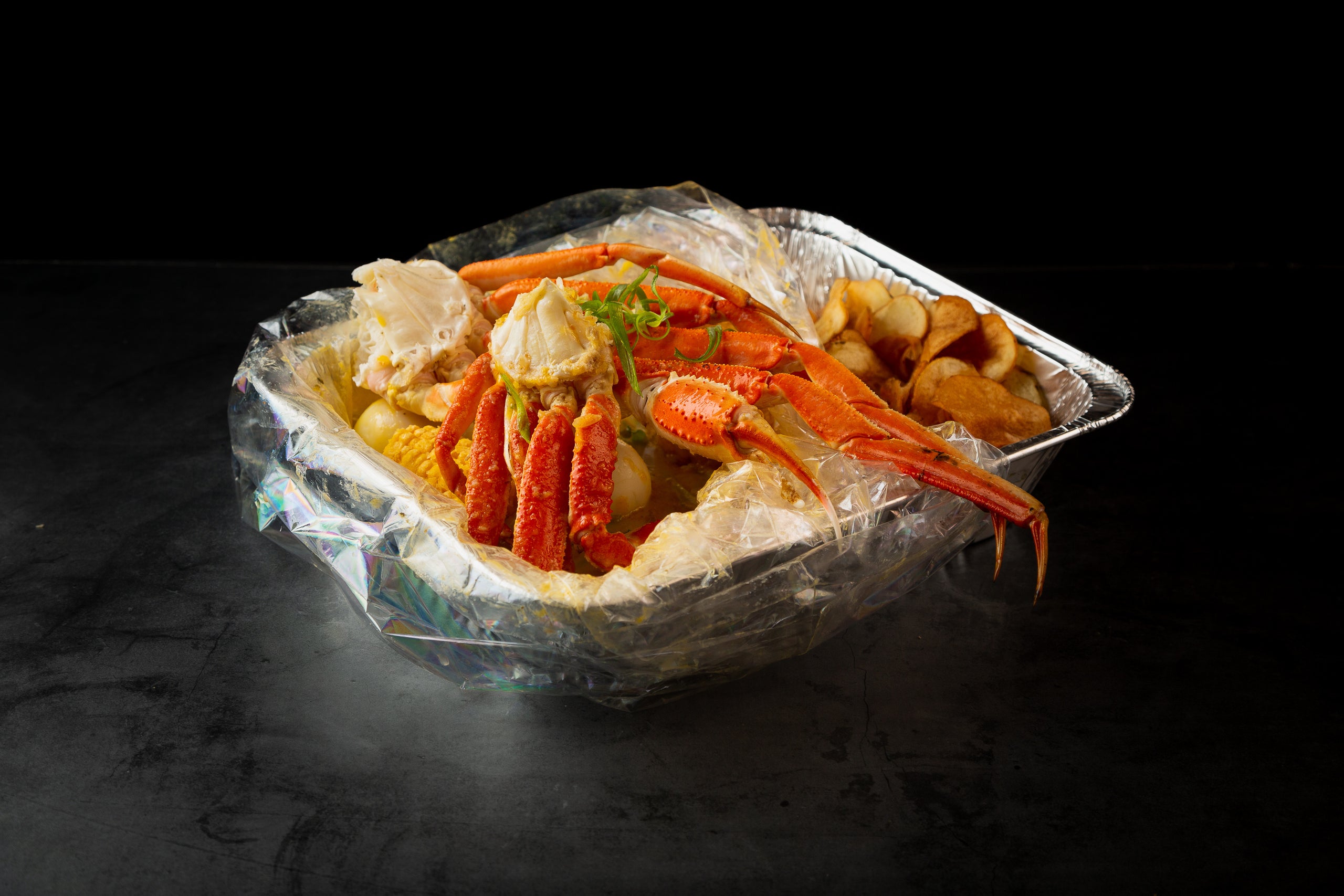 2 Snow Crab Leg Cluster Boil, Crispy Potatoes, Corn, Egg and Garlic ...